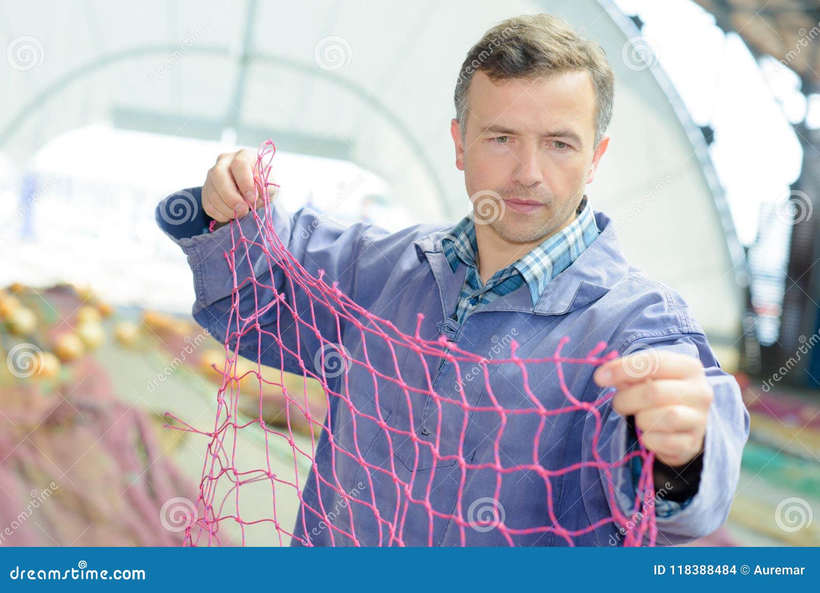 Man holding fishing net stock photo. Image of weaved - 118388484