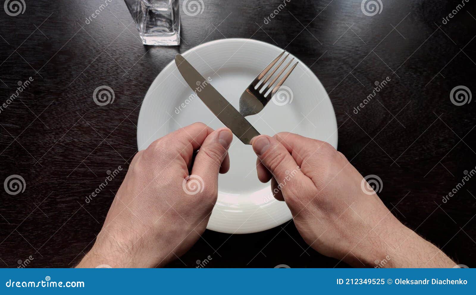 A Man Holding a Fork with a Knife at the Table Stock Video - Video of ...