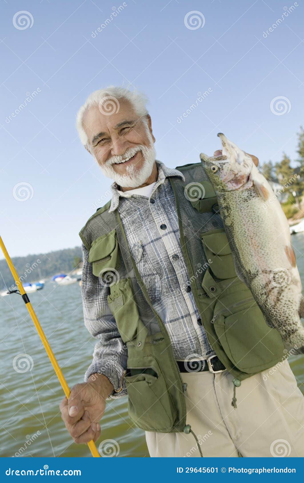 Man Holding a Fresh Catch stock image. Image of holding - 29645601