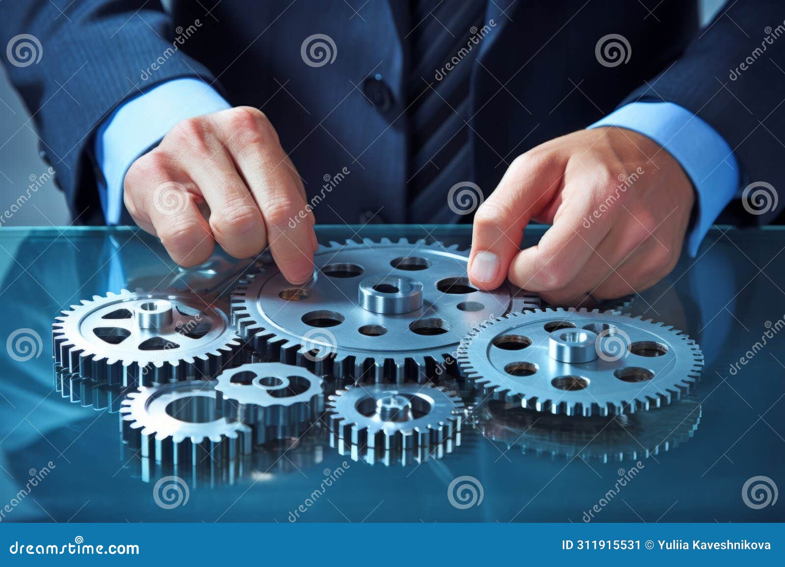 Man Holding Gear in Hands. Teamwork Metallic Silver Equipment ...
