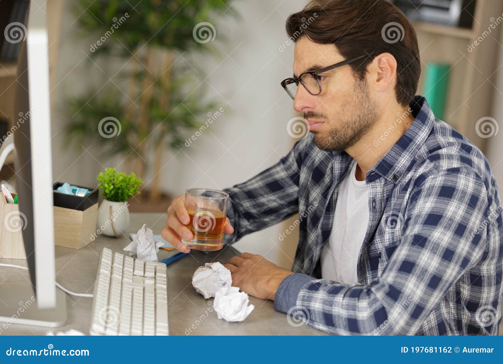 Man Holding Glass Drink Looking at Computer Screen Stock Photo - Image ...