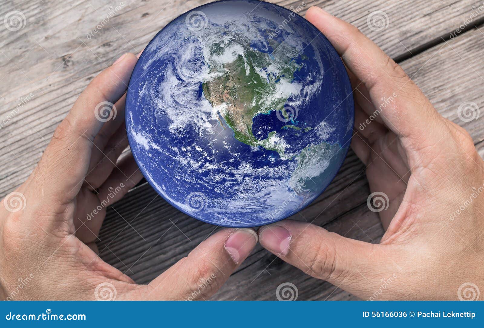 Man Holding Global in Hands , Elements of this Image Furnished B Stock ...