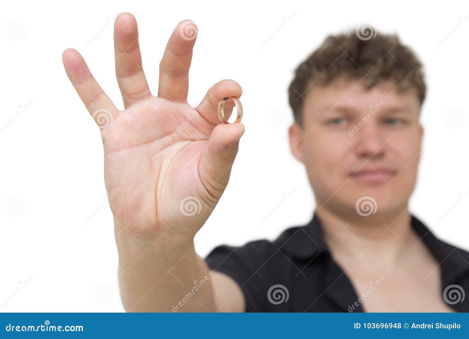 Man Holding a Gold Ring on a White Background Stock Photo - Image of ...