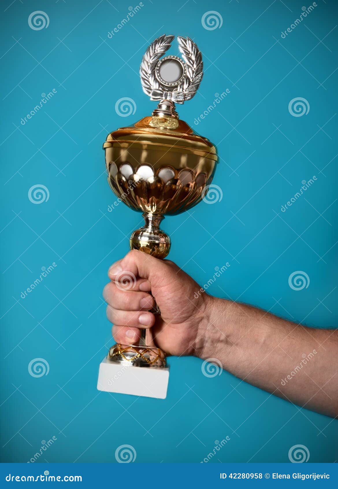 Man Holding a Golden Trophy Stock Photo - Image of cloud, reflection ...