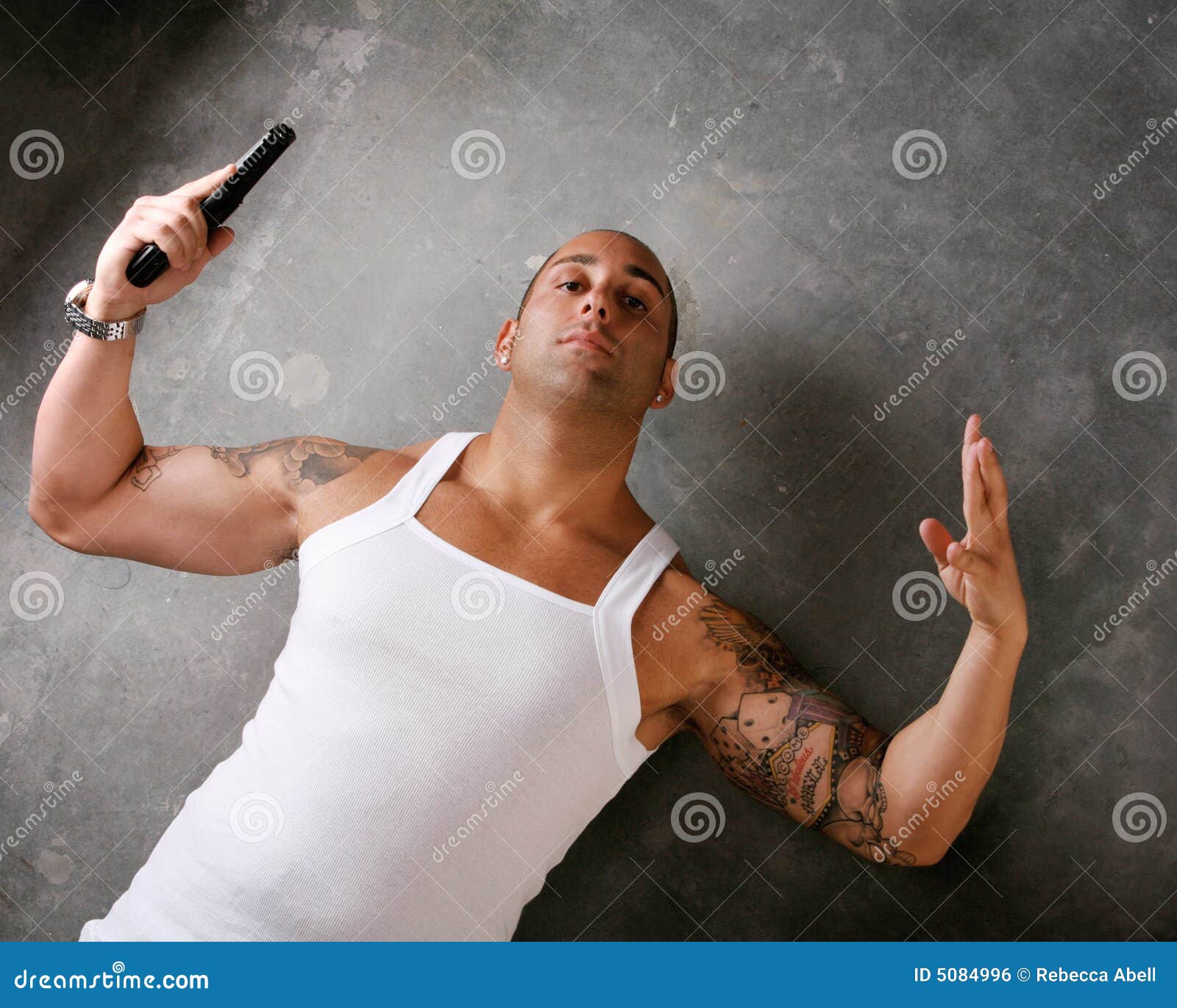 Man Holding Gun stock photo. Image of firearm, guys, tattoo - 5084996