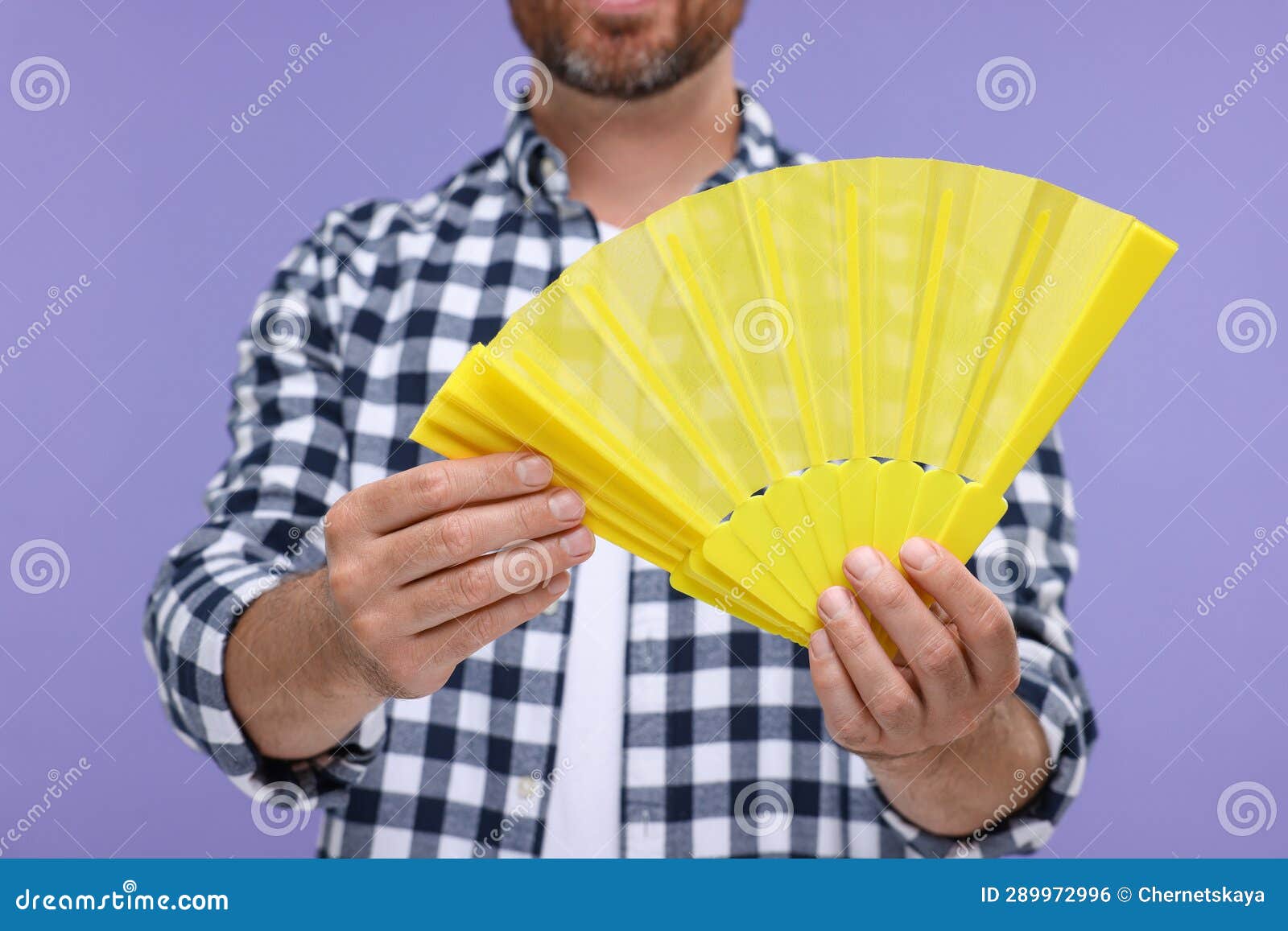 Man Holding Hand Fan on Purple Background, Closeup Stock Photo - Image ...