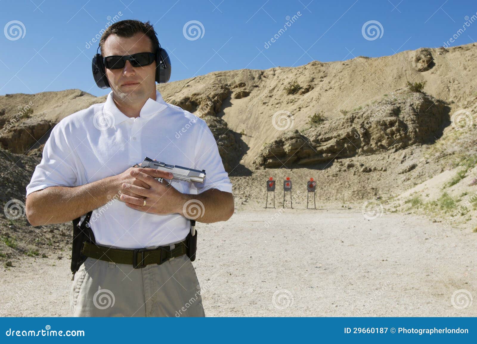 Man Holding Hand Gun at Firing Range Stock Image - Image of practicing ...