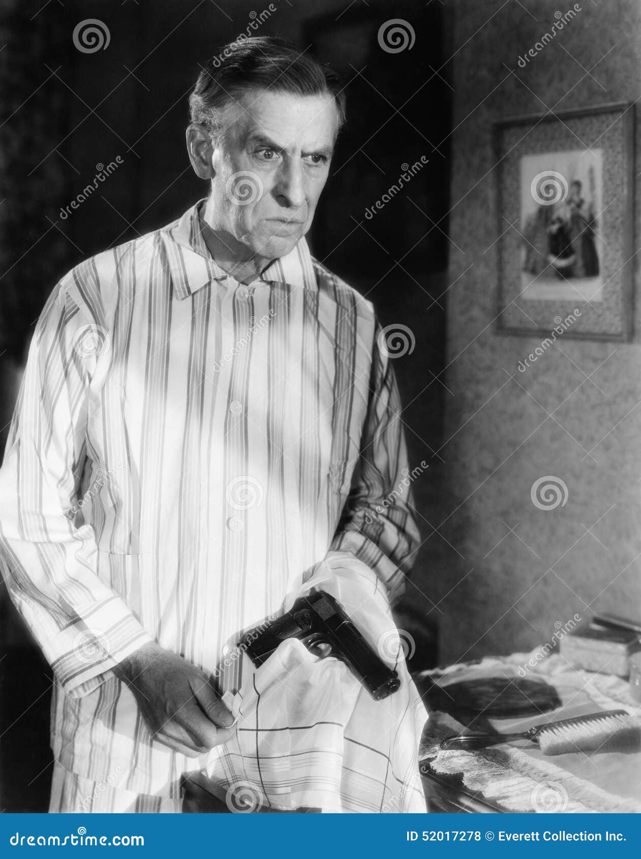 Man Holding a Handgun in a Handkerchief Looking Distraught Stock Photo ...