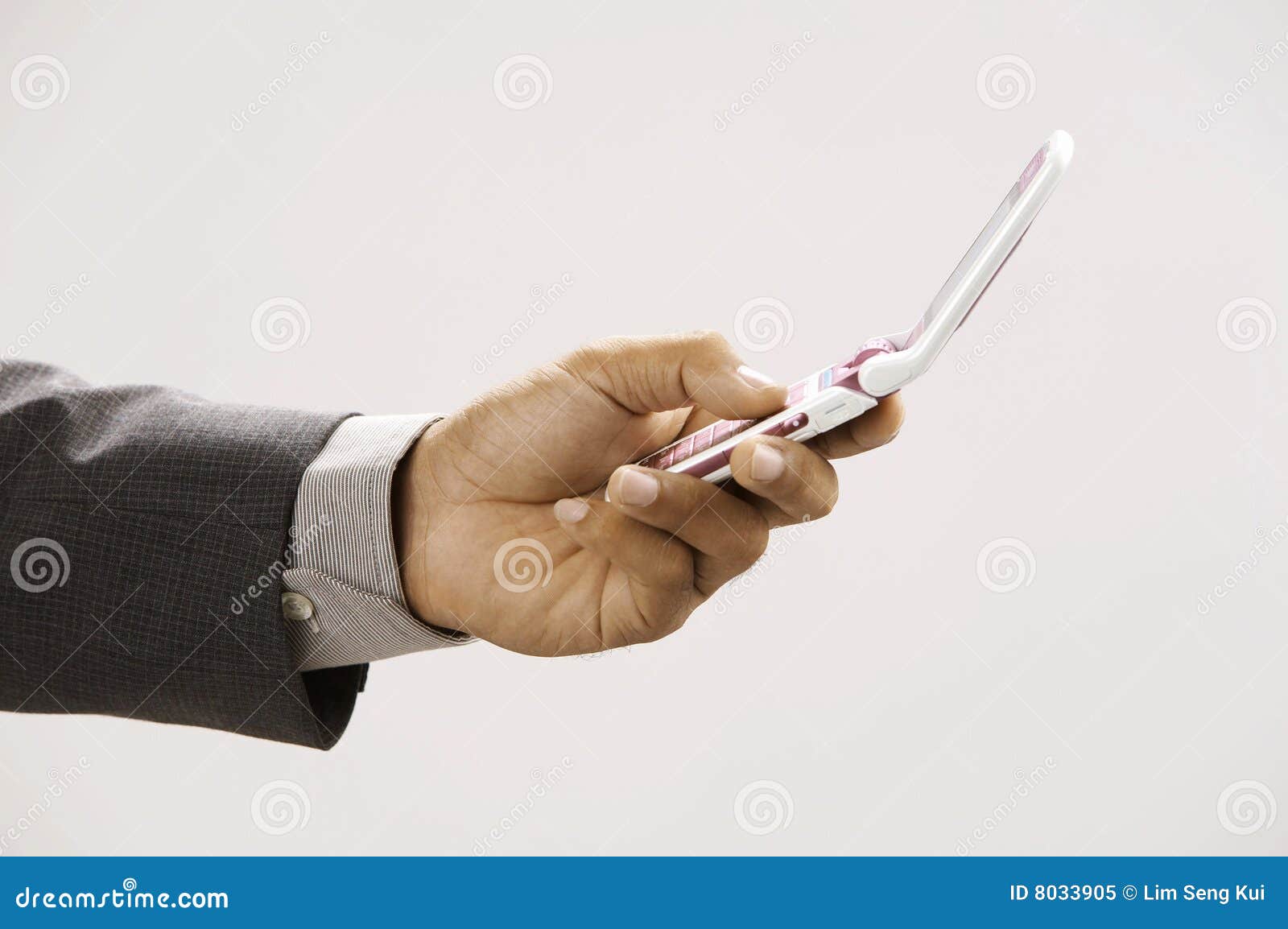 Man holding a handphone stock image. Image of suit, adults - 8033905