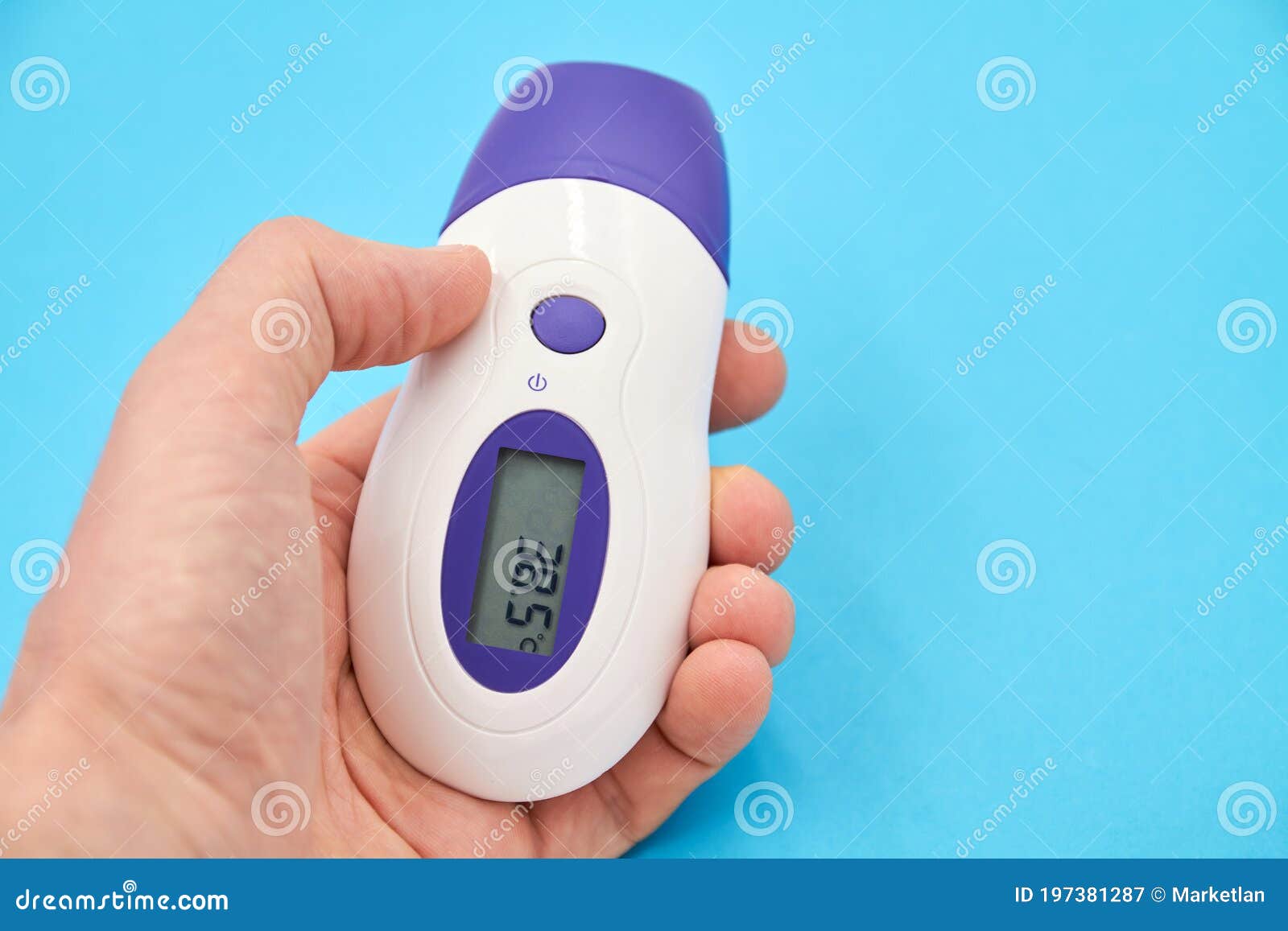 A Man Holding In His Hand An Electronic Non Contact Thermometer Showing