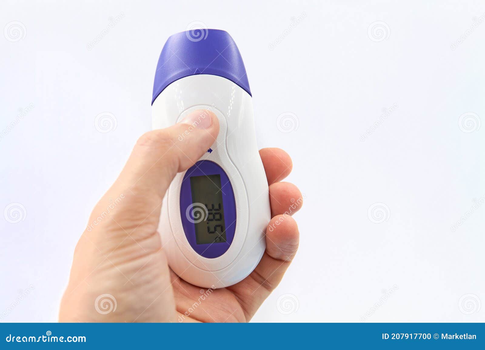 A Man Holding In His Hand An Electronic Non Contact Thermometer Showing