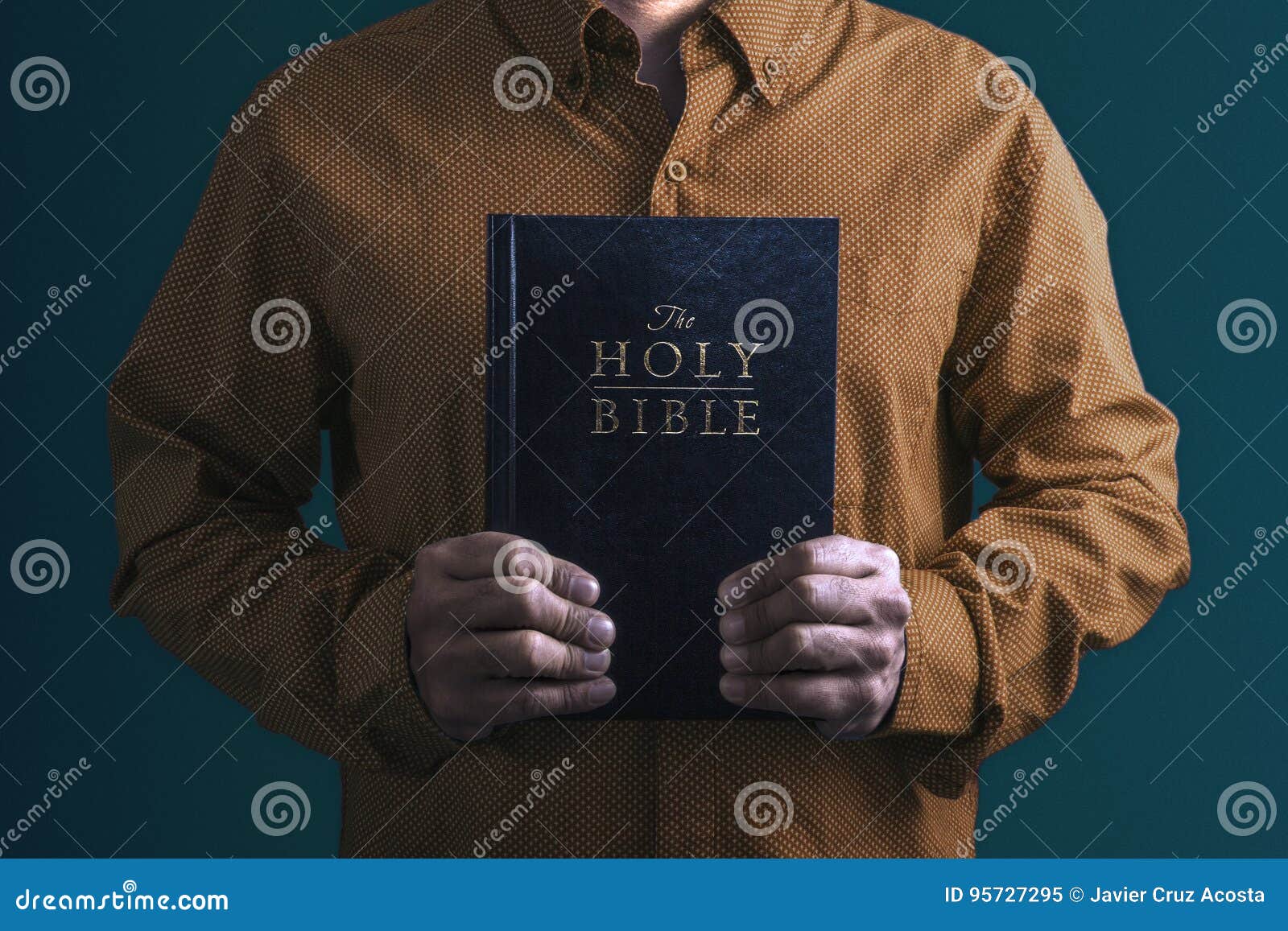 Man Holding the Holy Bible on His Chest Stock Image - Image of book ...