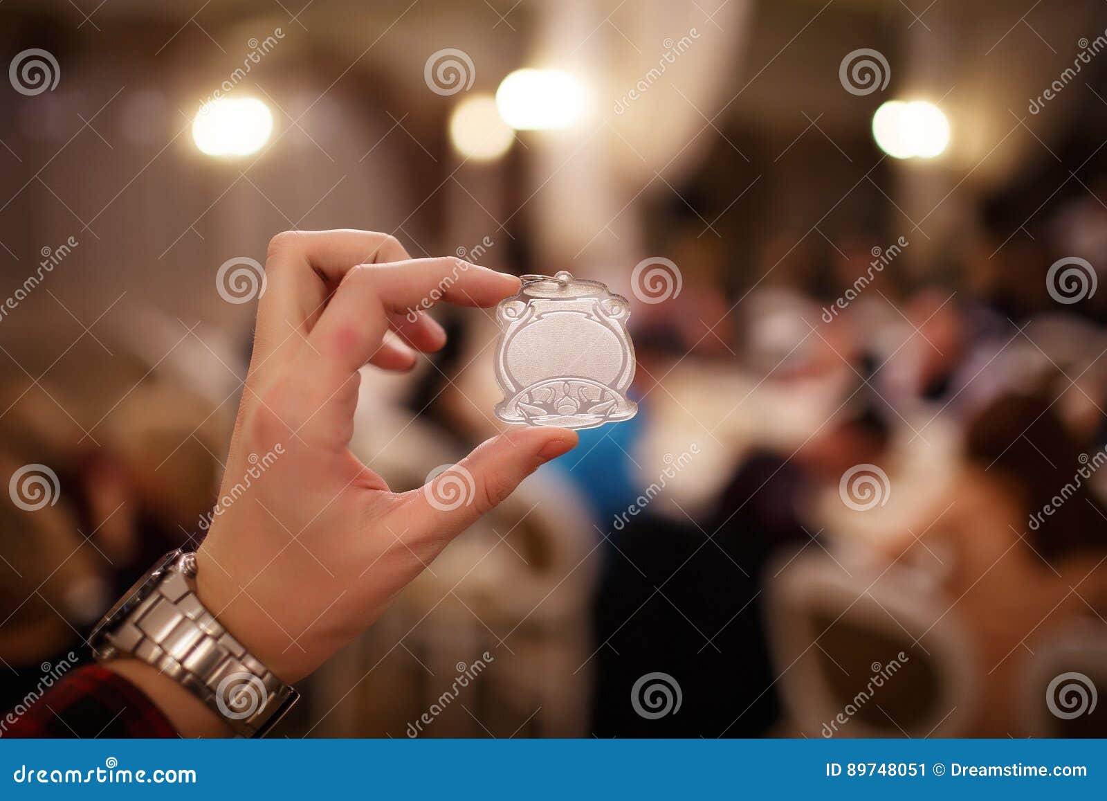 Man holding a hotel token stock image. Image of number - 89748051