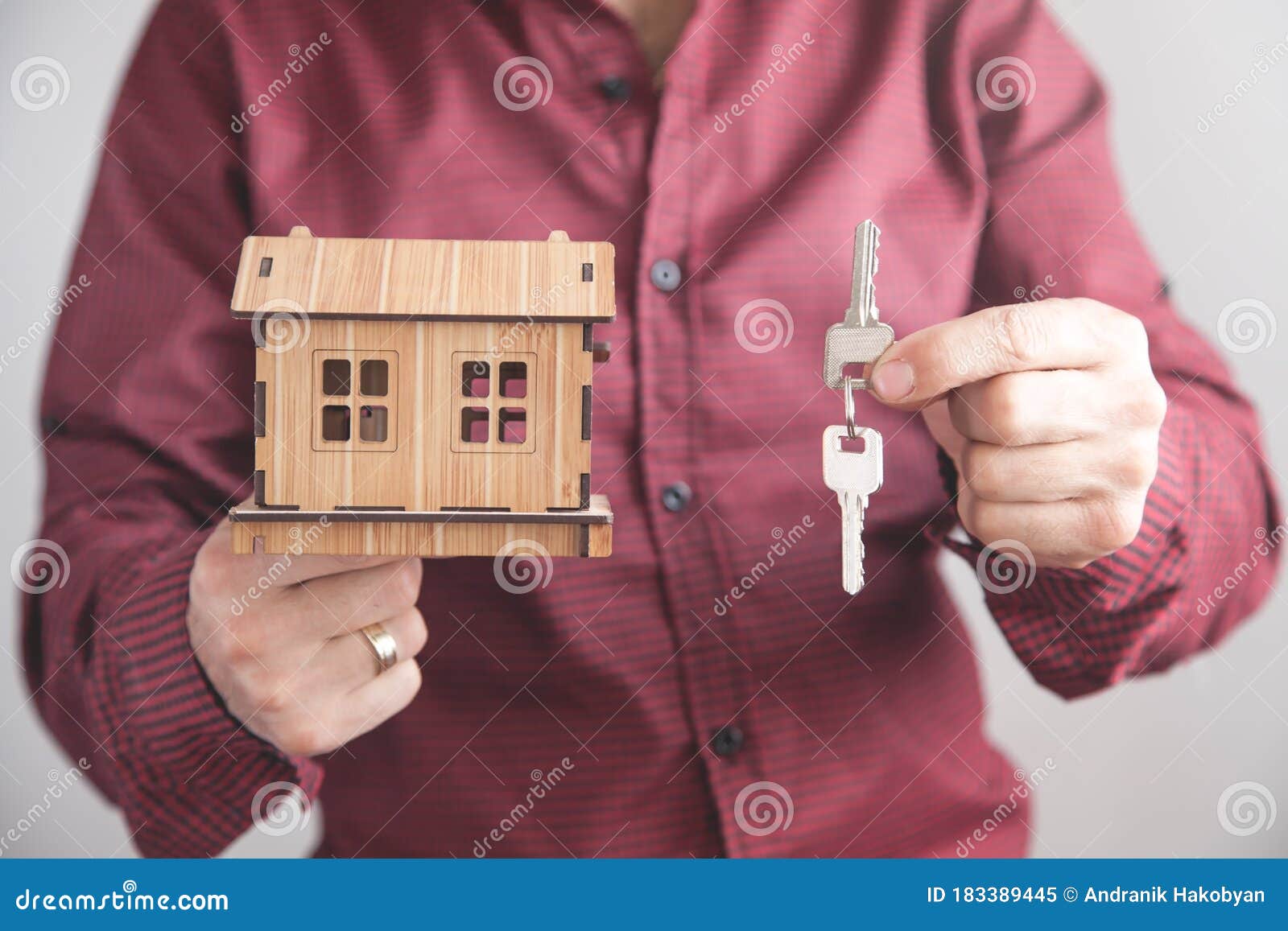 Man Holding House Keys with House Model in Office Stock Image - Image ...
