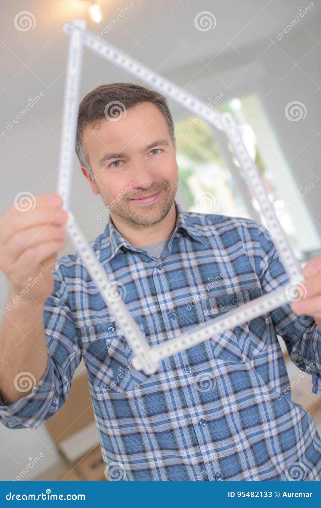 Man Holding House Shaped Ruler Stock Image - Image of carpentry ...