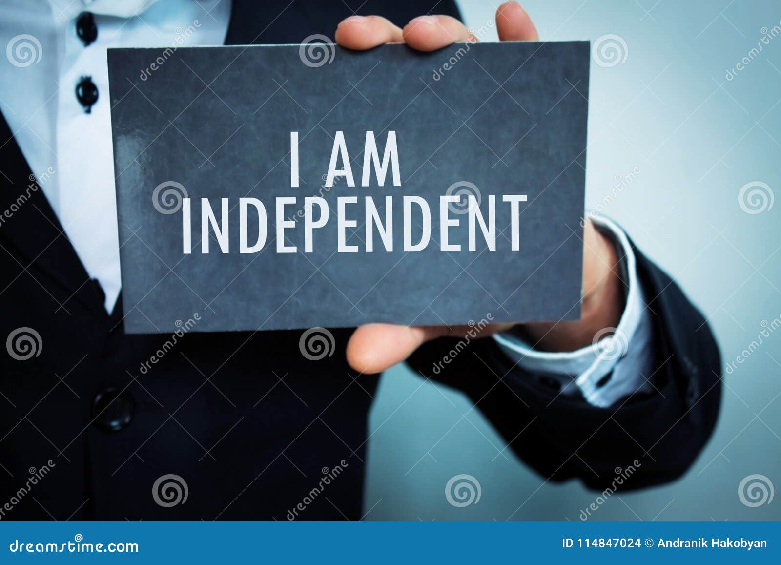 Man Holding I am Independent Text. Stock Photo - Image of independent ...