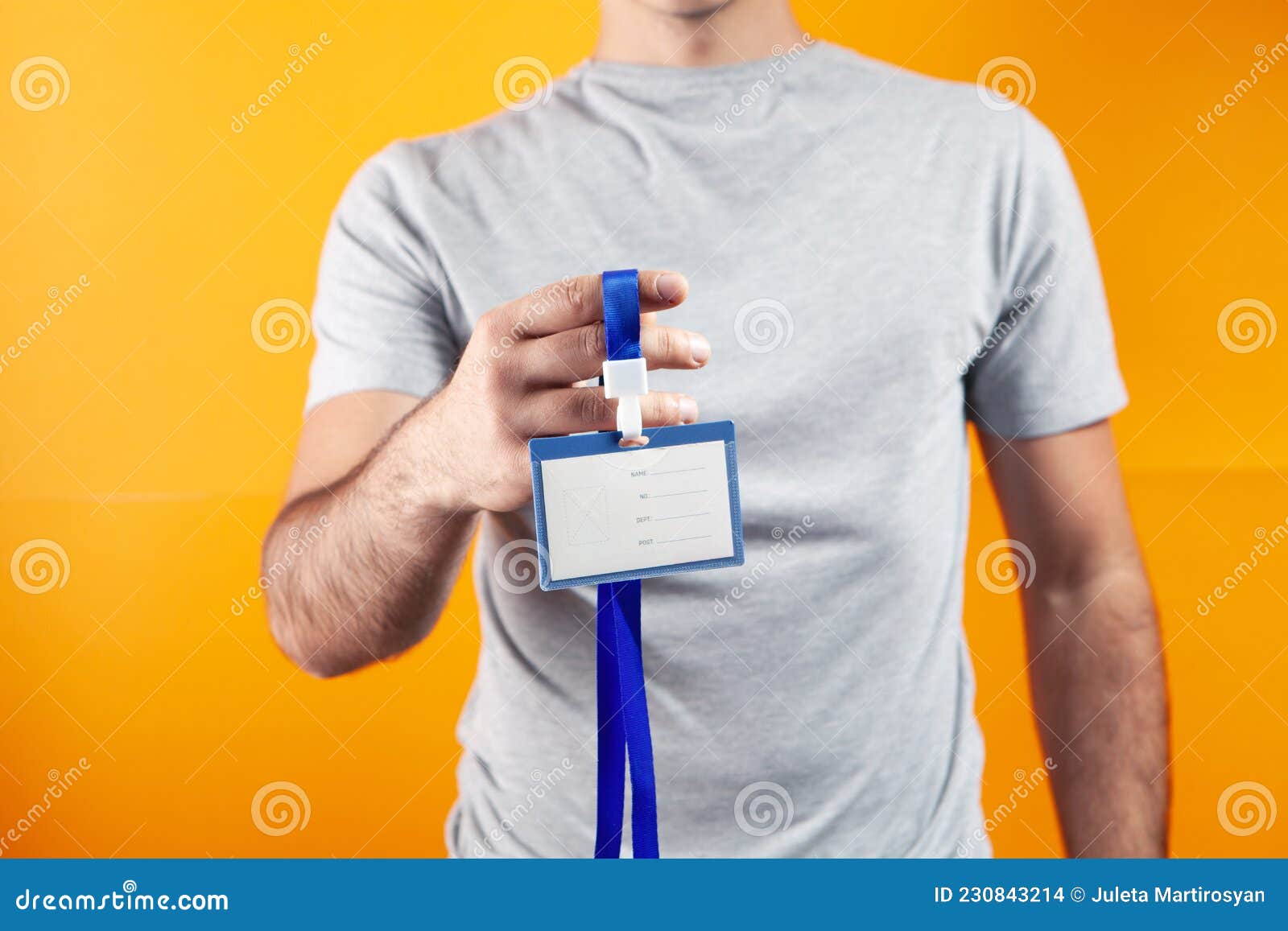 Man Holding ID Tag on Orange Background Stock Photo - Image of identity ...