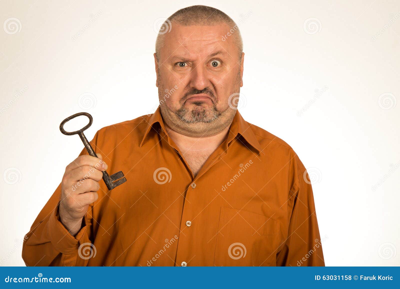 A Man Holding a Key To Success Stock Photo - Image of young, people ...