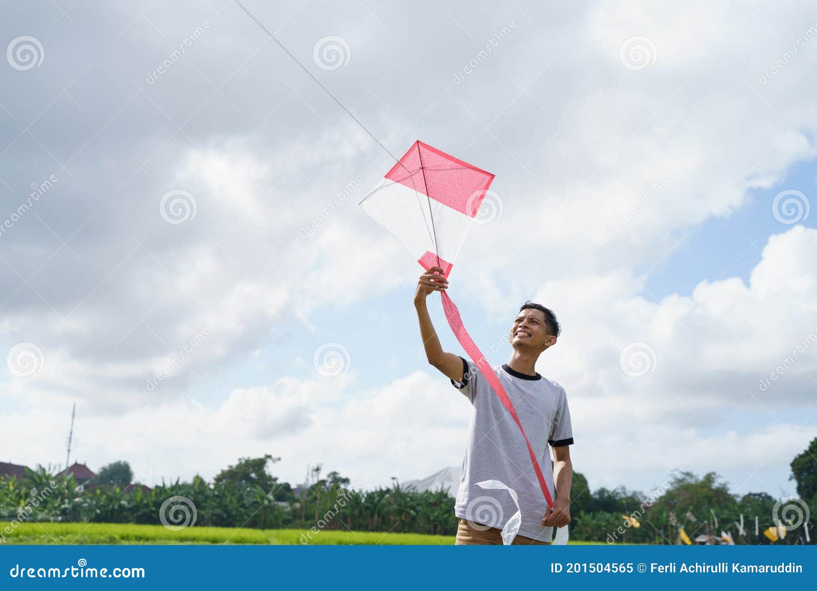 A man holding a kite stock image. Image of amazing, indonesian - 201504565