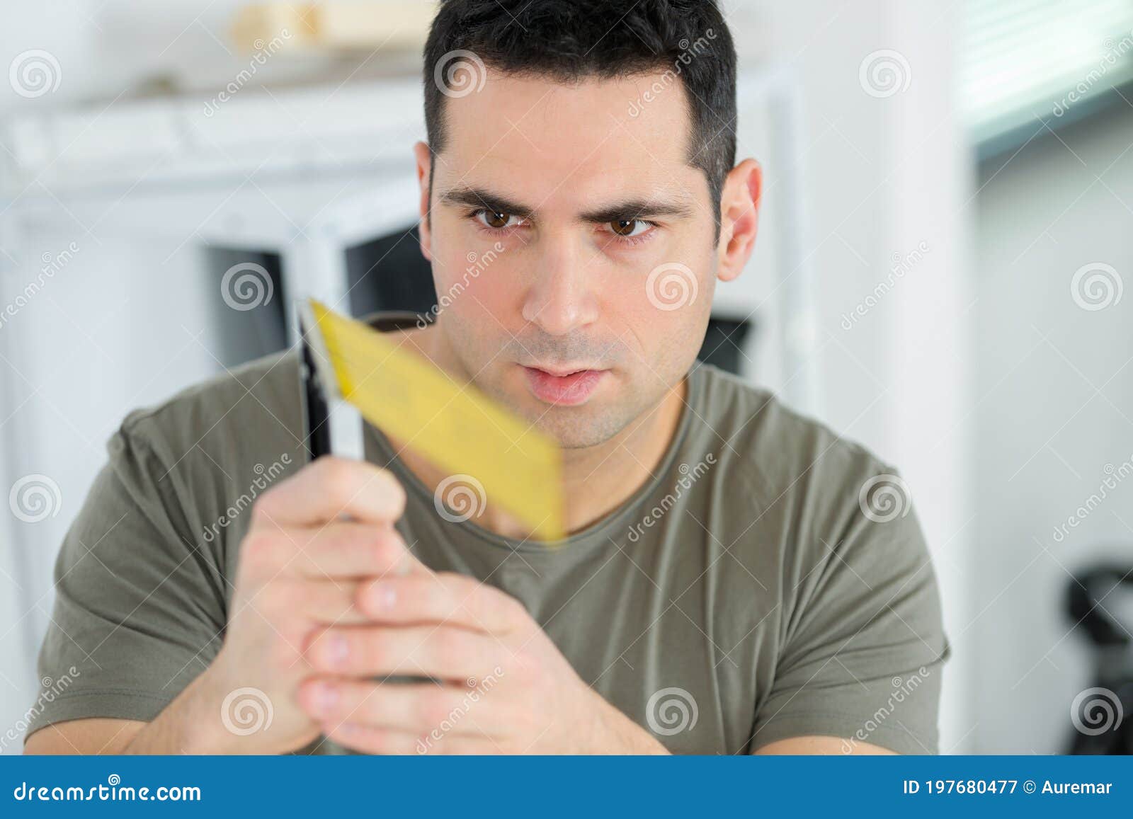 Man Holding L-shaped Angle Ruler Stock Image - Image of ruler, meter ...