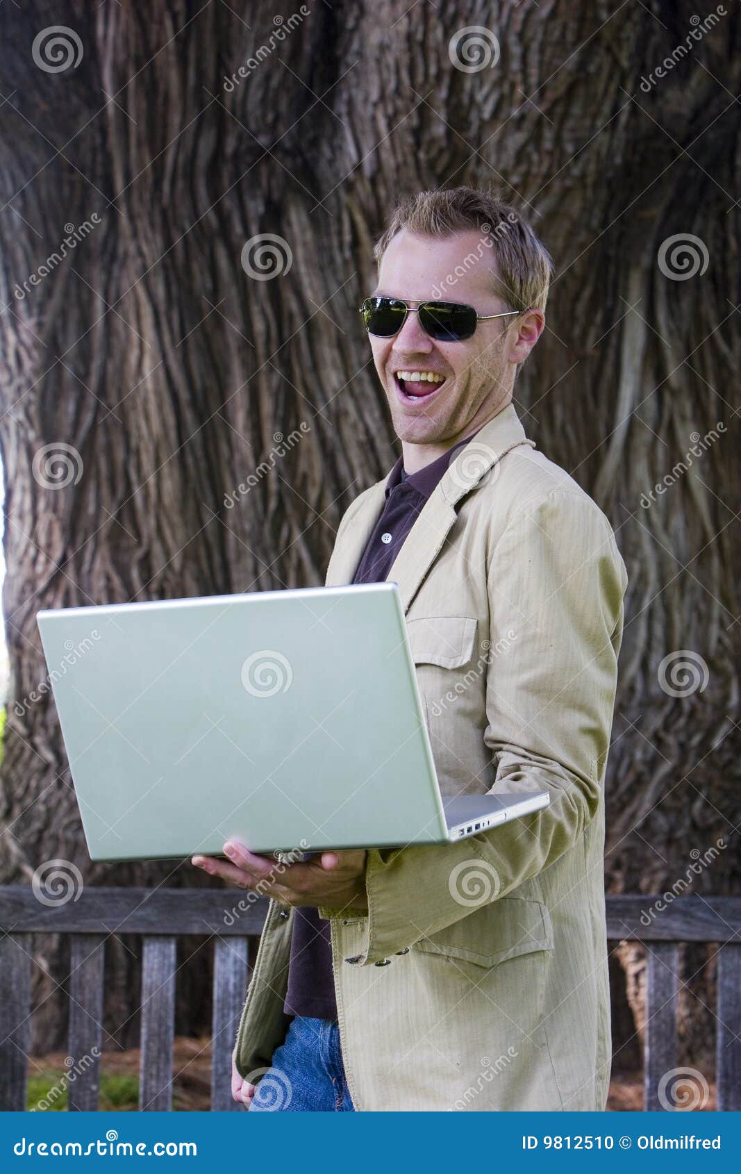 Man Holding Laptop Computer Stock Photo - Image of joyful, young: 9812510