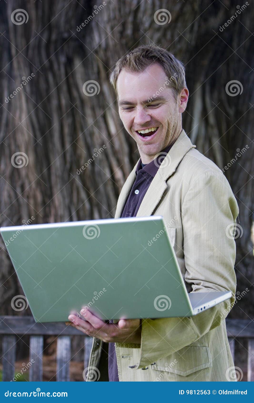Man Holding Laptop Computer Stock Image - Image of work, young: 9812563