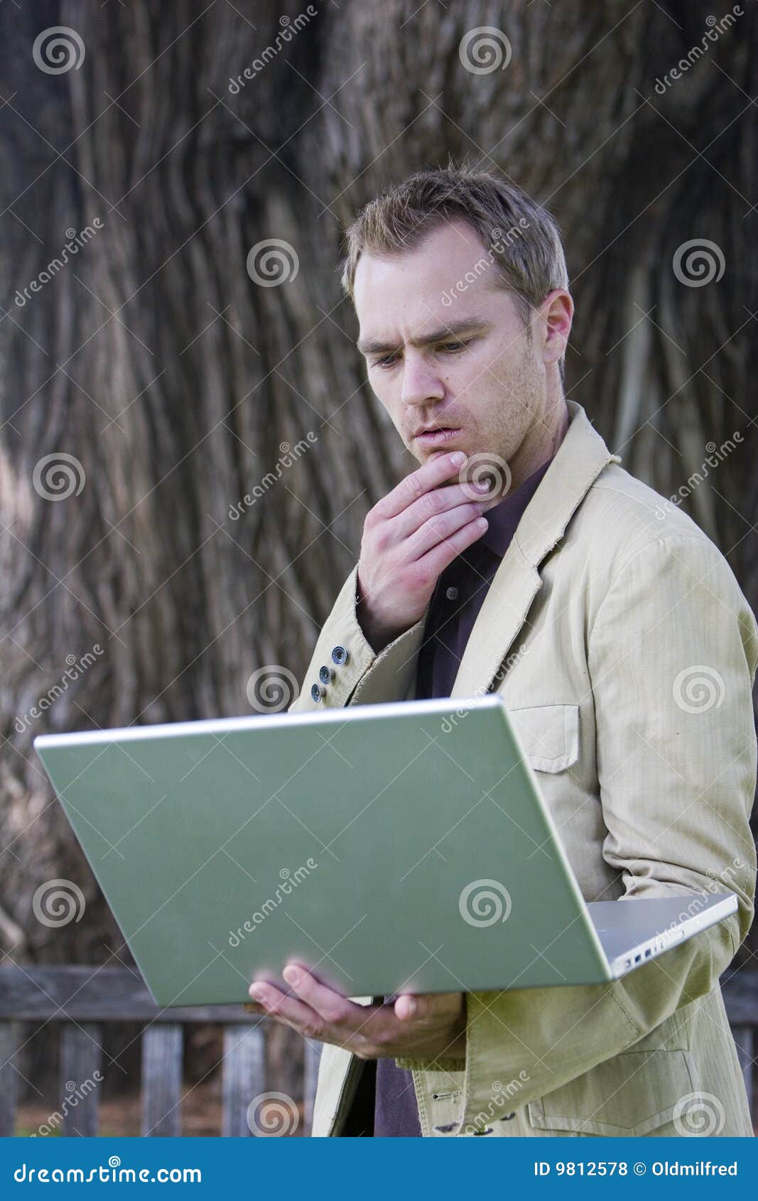 Man Holding Laptop Computer Stock Photo - Image of work, outdoor: 9812578