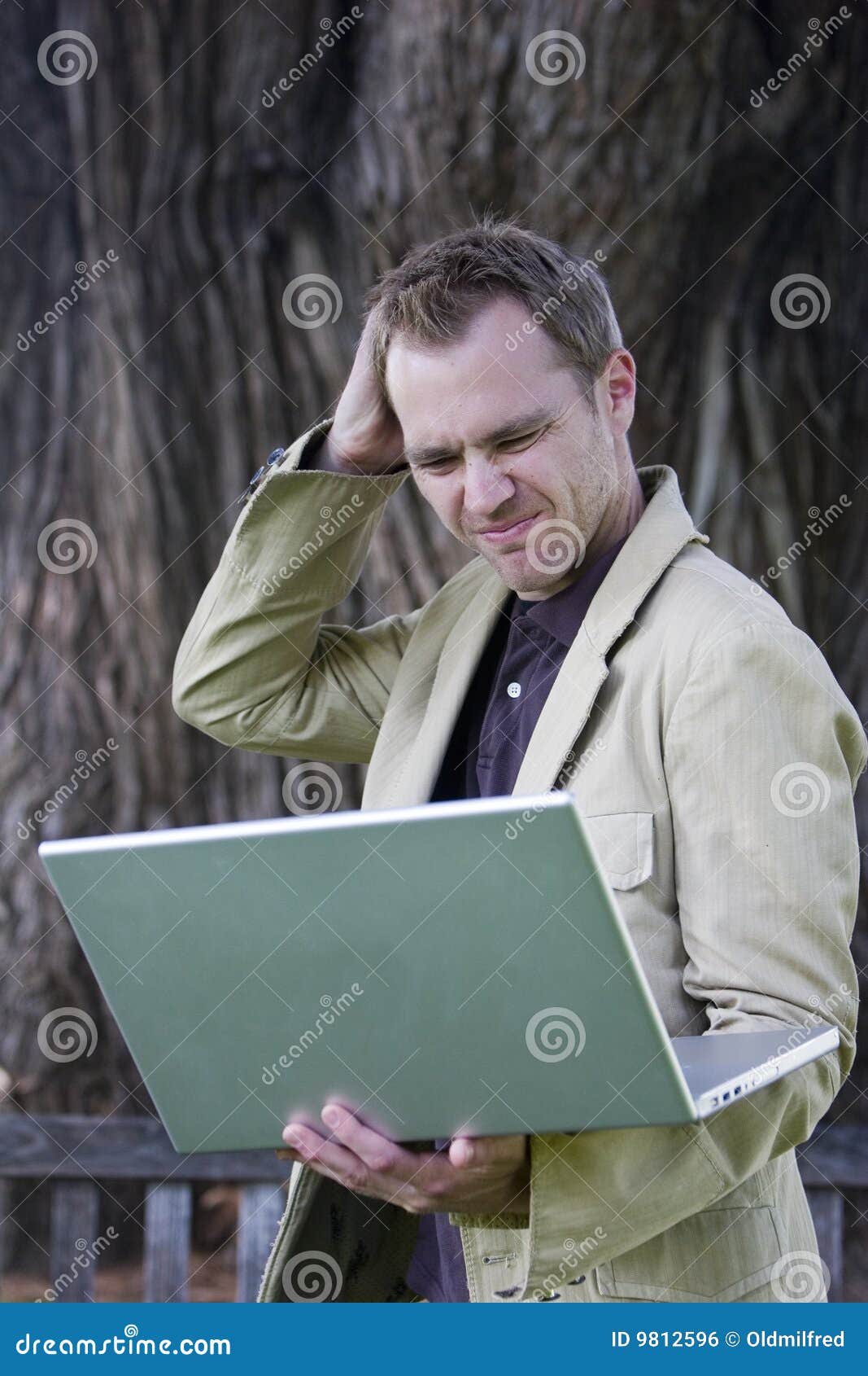 Man Holding Laptop Computer Stock Photo - Image of laptop, question ...