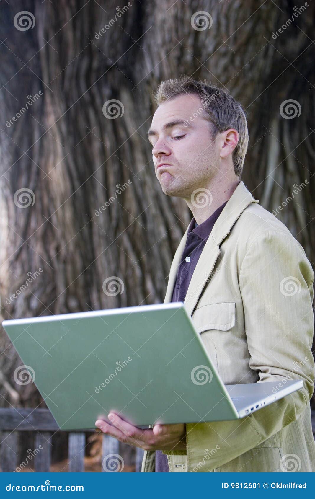 Man Holding Laptop Computer Stock Image - Image of work, park: 9812601