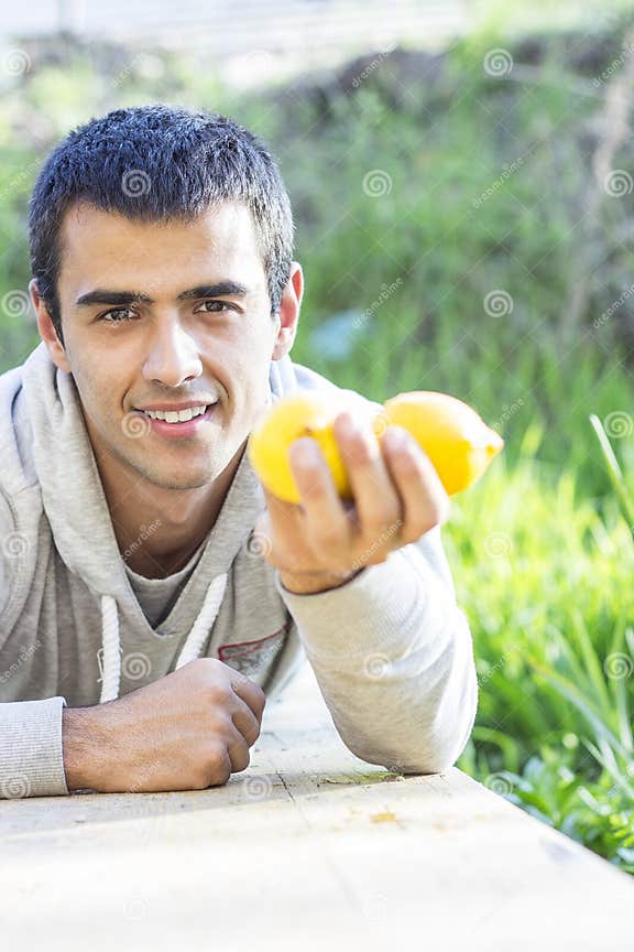 Man holding an lemons stock photo. Image of smile, fruit - 39344720