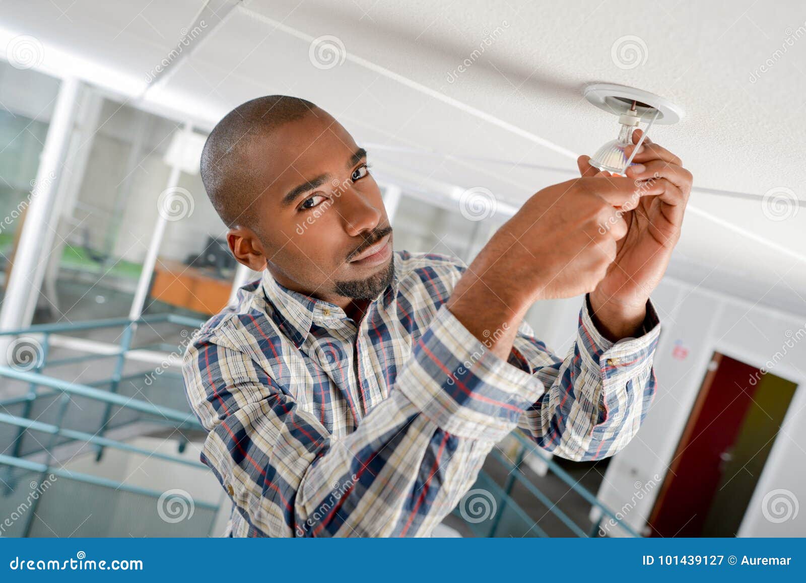 Man holding light bulb stock image. Image of holding - 101439127