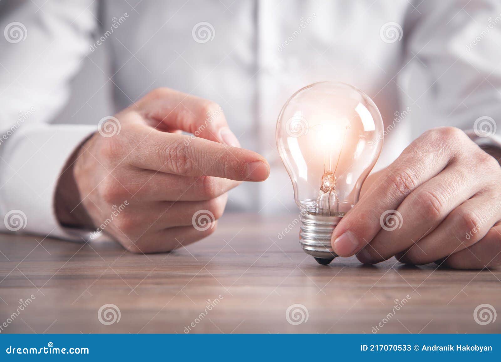 Man Holding Light Bulb. Concept of Inspiration and Creativity Stock ...