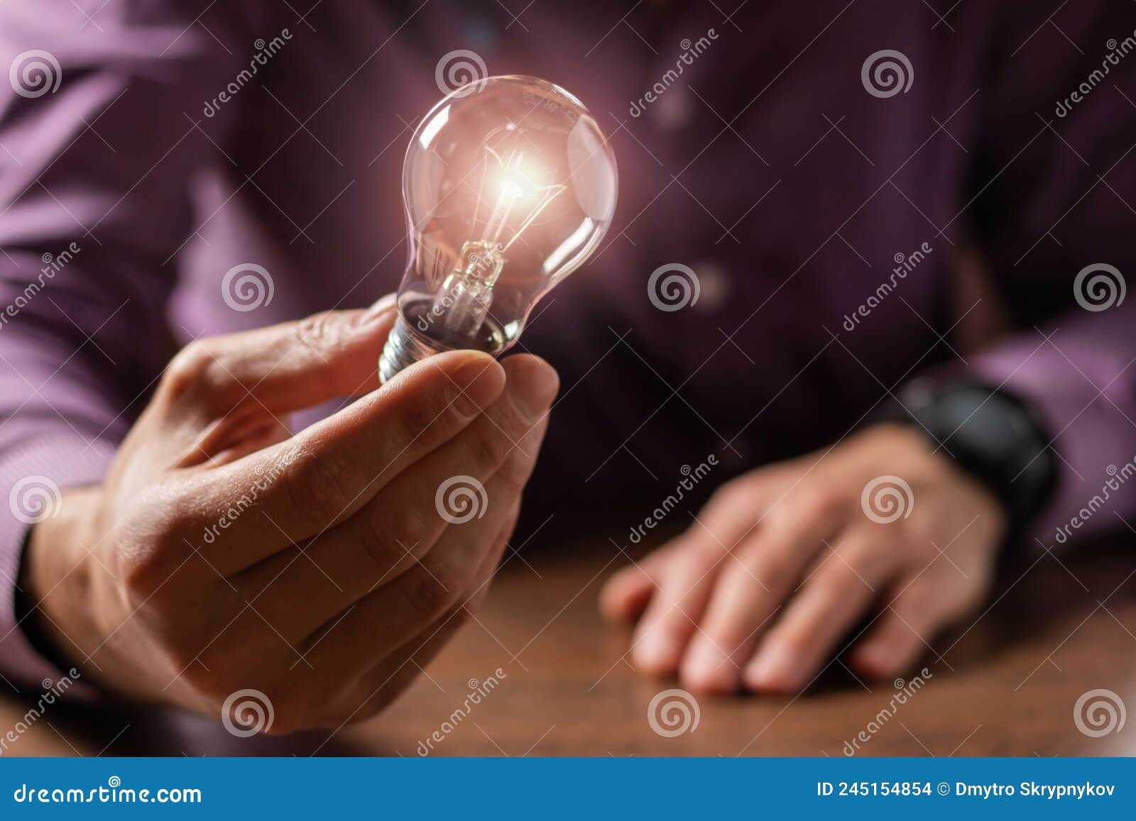 Man Holding Light Bulb in Hand. Idea Concept with Innovation and ...