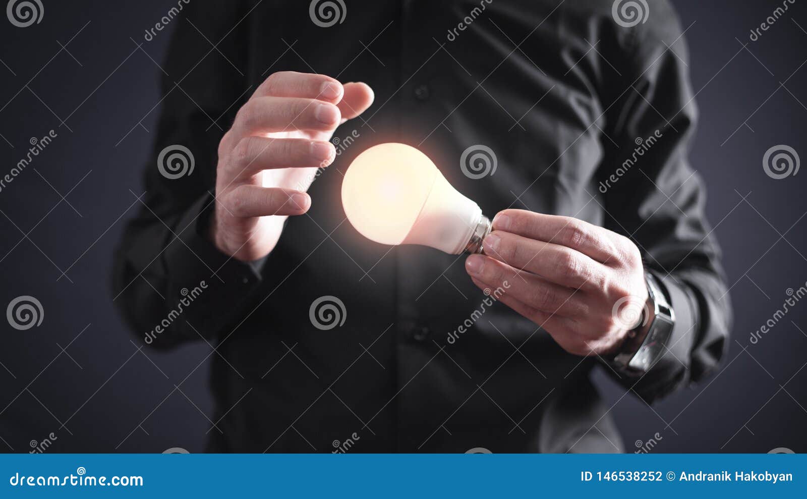 Man Holding Light Bulb. Inspiration and Creativity Stock Photo - Image ...