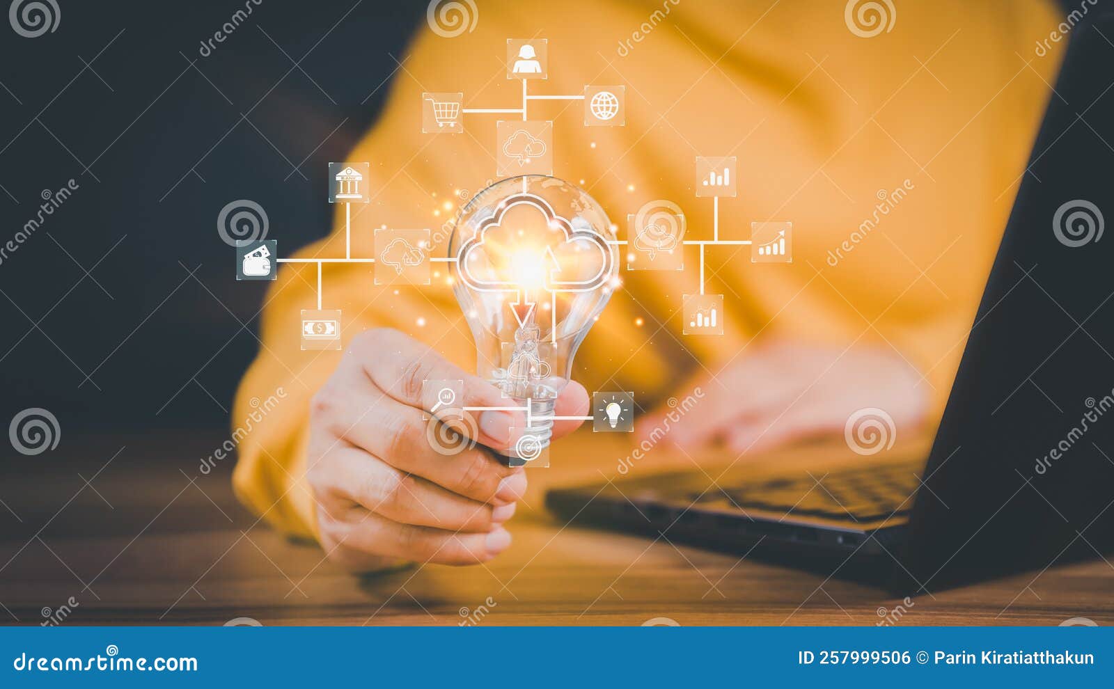 Man Holding a Light Bulb while Working on the Computer To Think and ...
