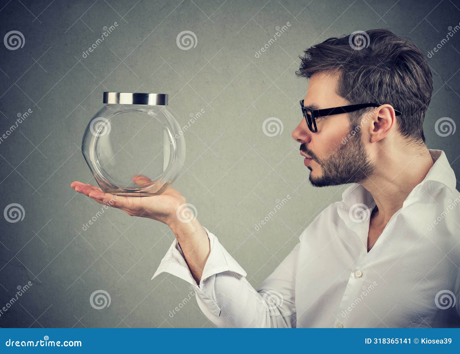 Man Holding and Looking at an Empty Glass Jar Stock Image - Image of ...