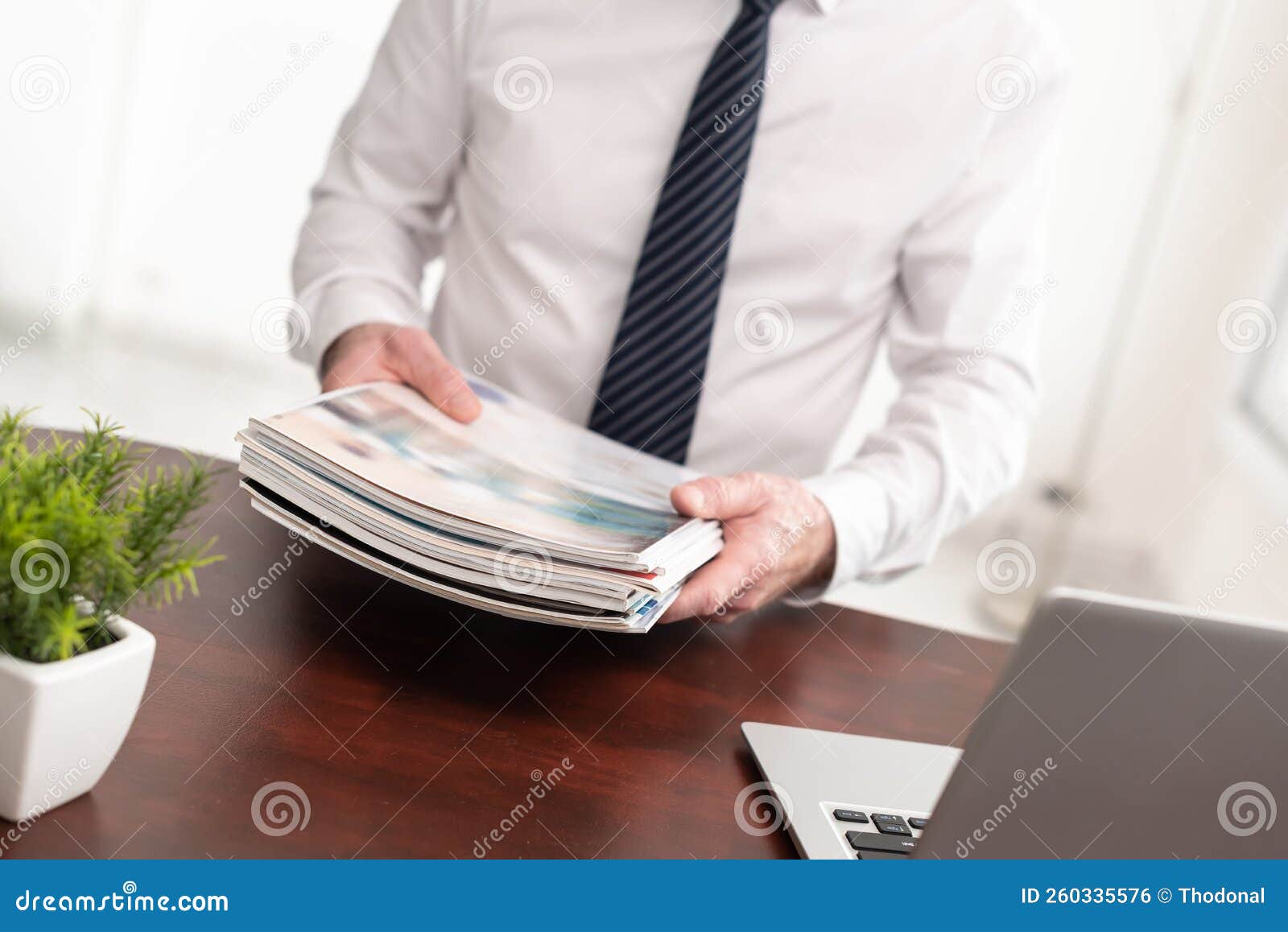 Man holding magazines stock photo. Image of news, knowledge - 260335576