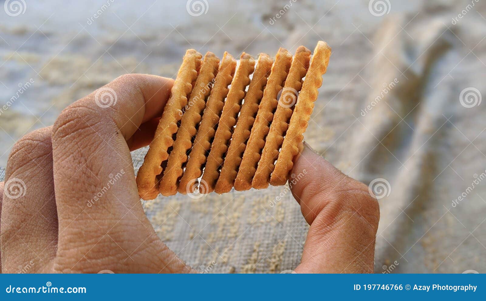 Man Holding Many Biscuits on Hand. Many Brown Wheat Biscuits with Tea ...