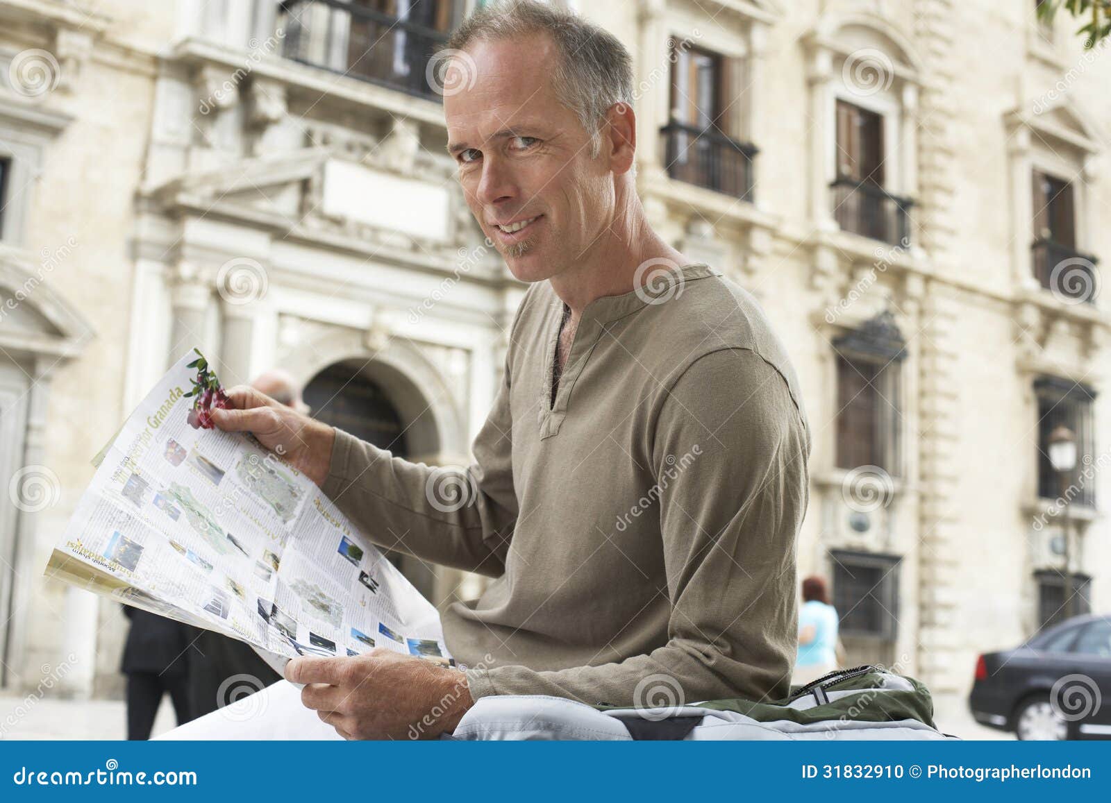 Man Holding Map in Front of Building Stock Photo - Image of sightseeing ...