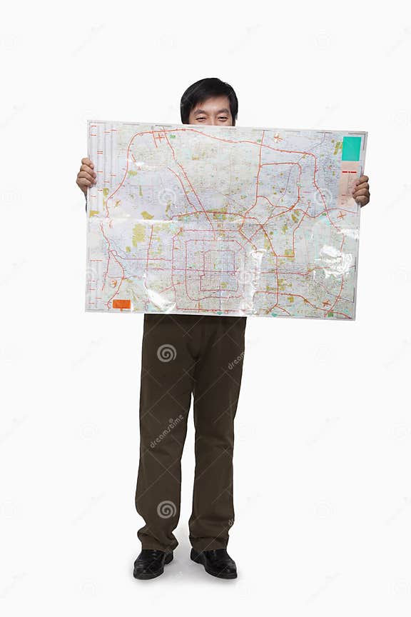 Man Holding Map, Studio Shot Stock Photo - Image of person, face: 31131602