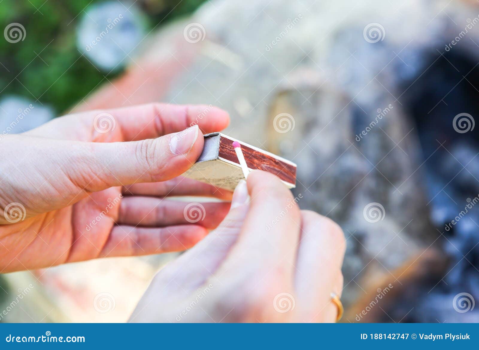 Man is Holding Matches in Hands. Person is Making Fire Outdoors Stock ...