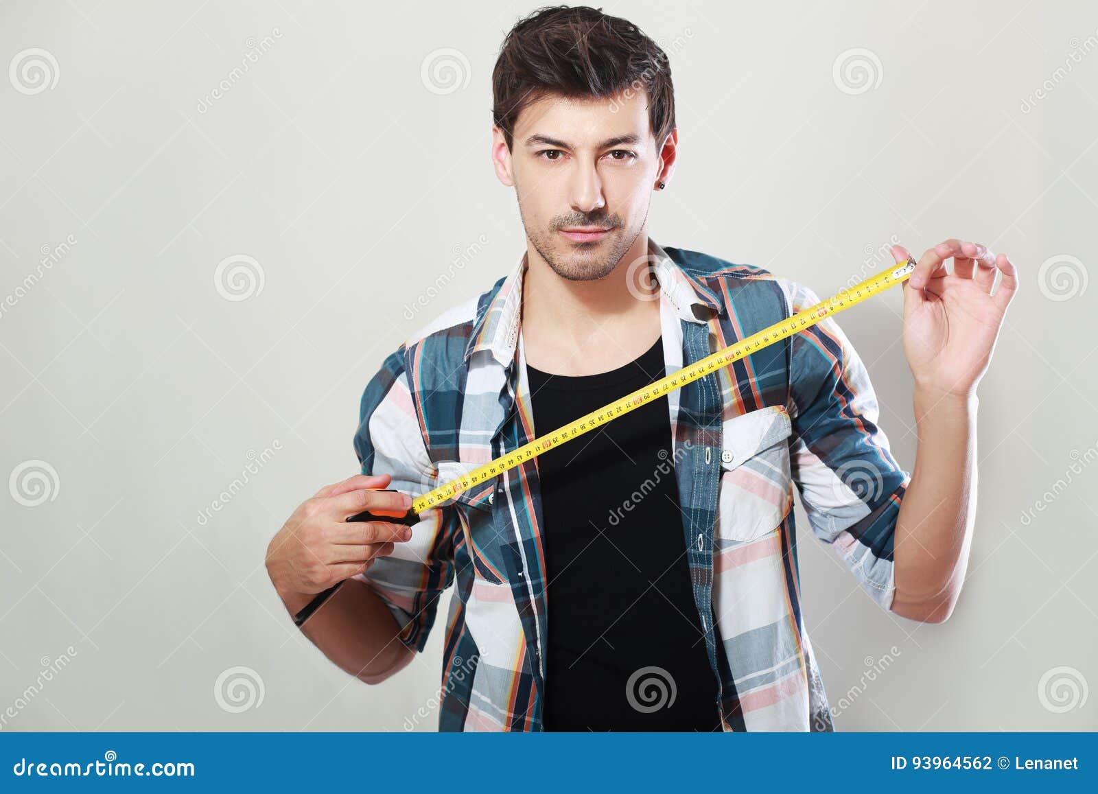 Man holding measure tape stock photo. Image of beautiful - 93964562