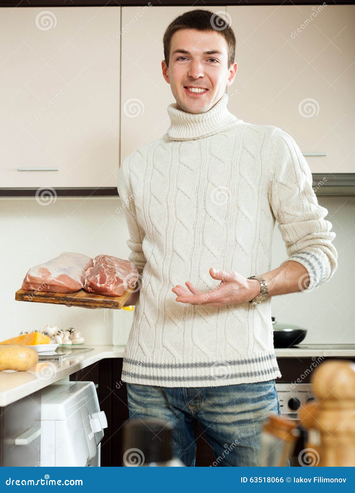 Man Holding Meat in Domestic Kitchen Stock Photo - Image of cuisine ...