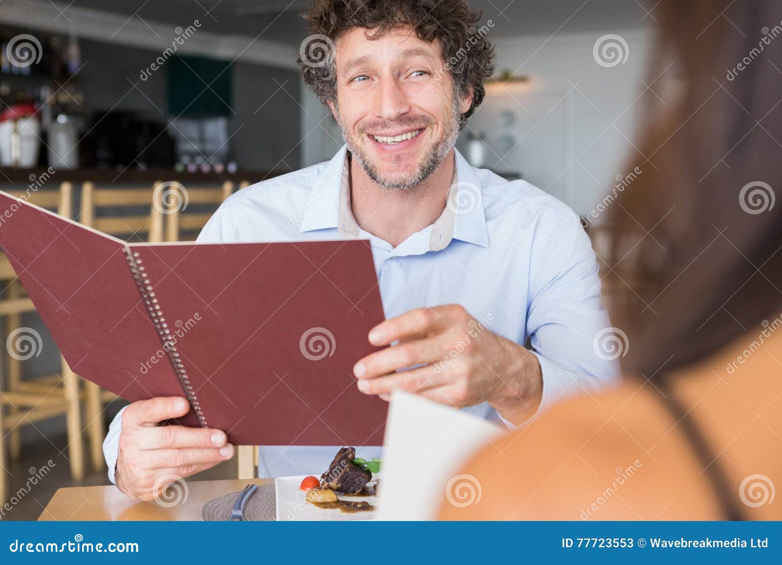 Man Holding Menu Card and Smiling Stock Image - Image of holding ...