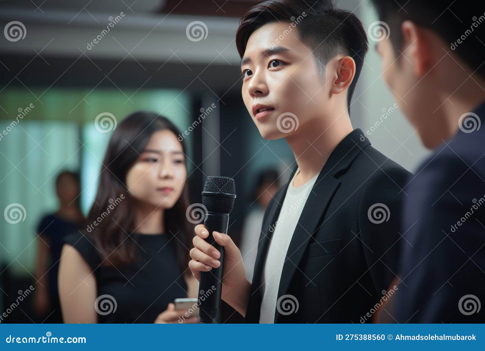 A Man Holding Mic Public Speaking in Front of the Audience. Photo ...