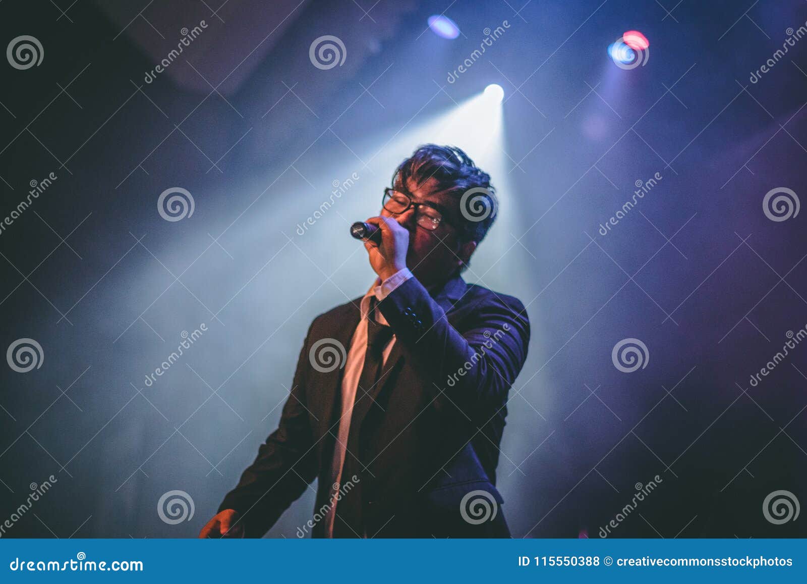 Man Holding Microphone On Stage Picture. Image: 115550388