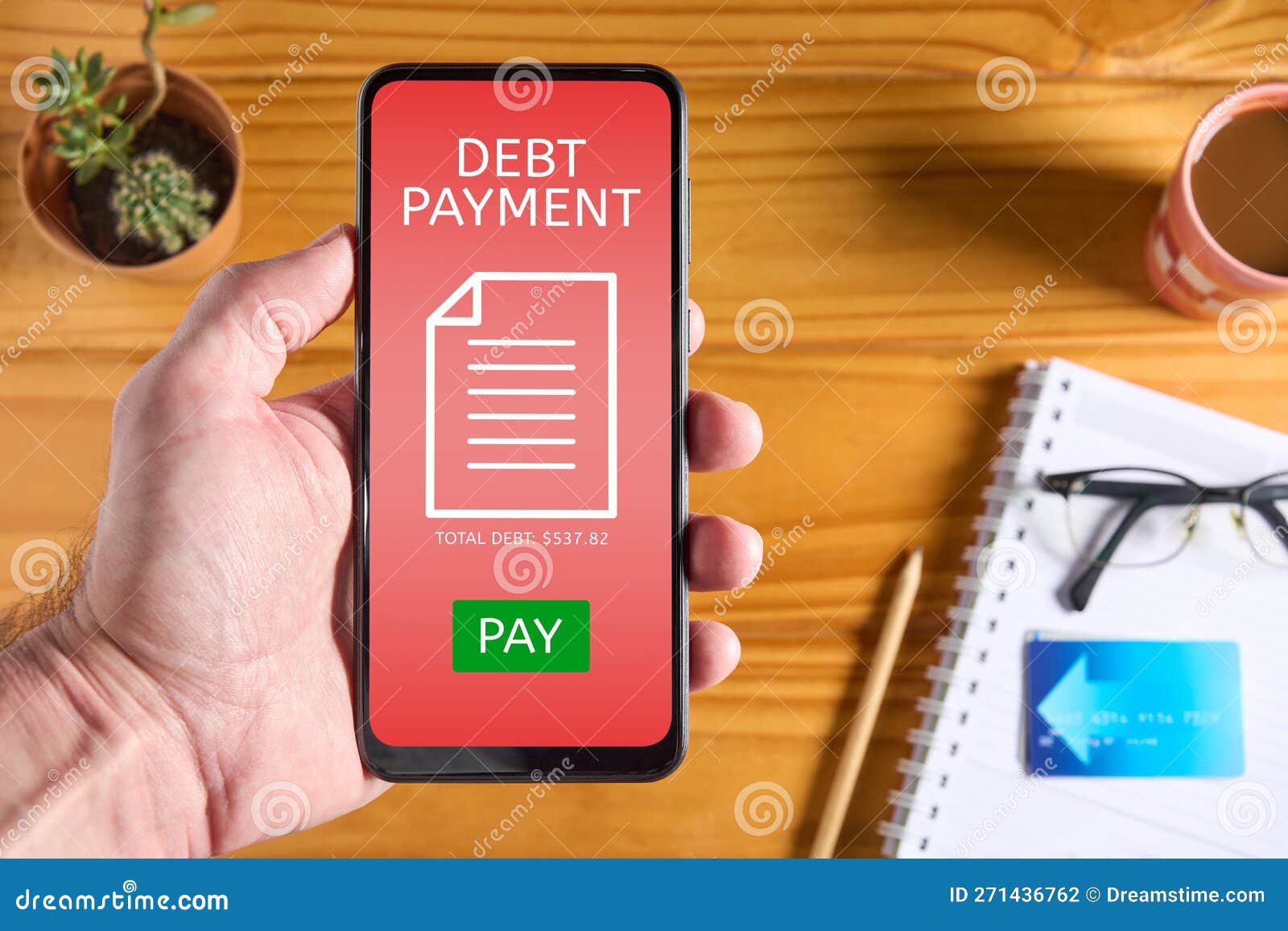 Man Holding Mobile Phone with Debt Payment App Interface on the Screen ...