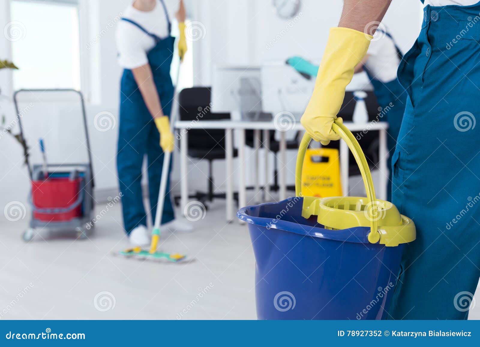 Man holding mop bucket stock photo. Image of uniform - 78927352
