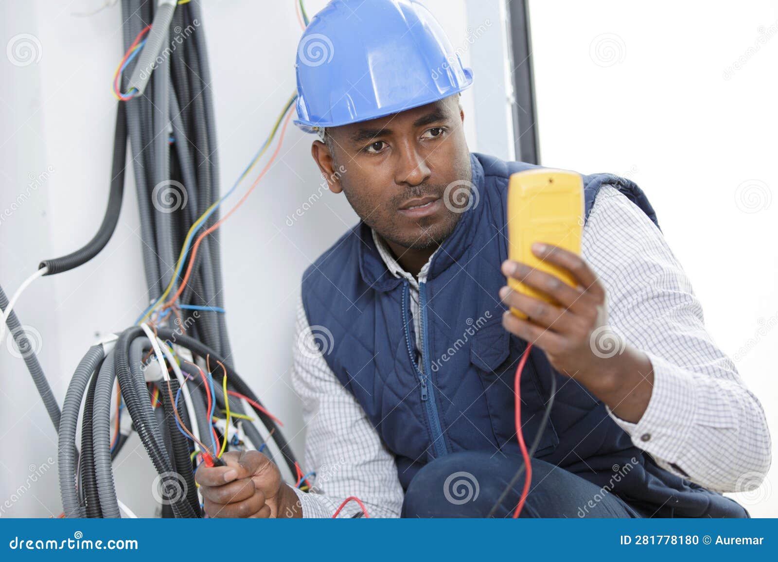 Man holding a multimeter stock photo. Image of technology - 281778180