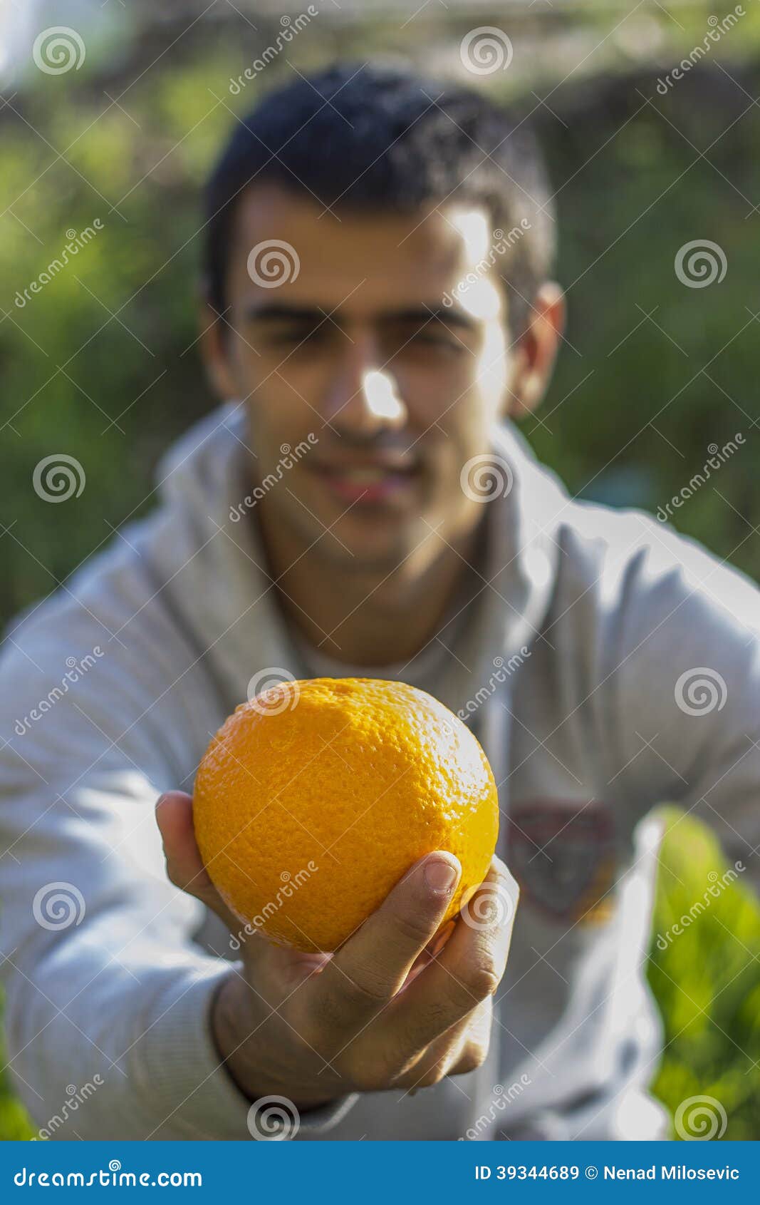 Man holding an orange stock image. Image of grab, small - 39344689